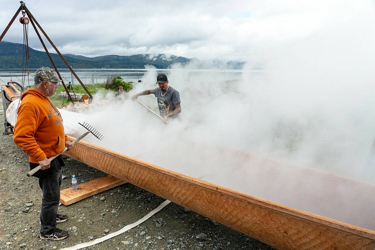 Traditional canoe, carved with traditional methods, emerges from ...